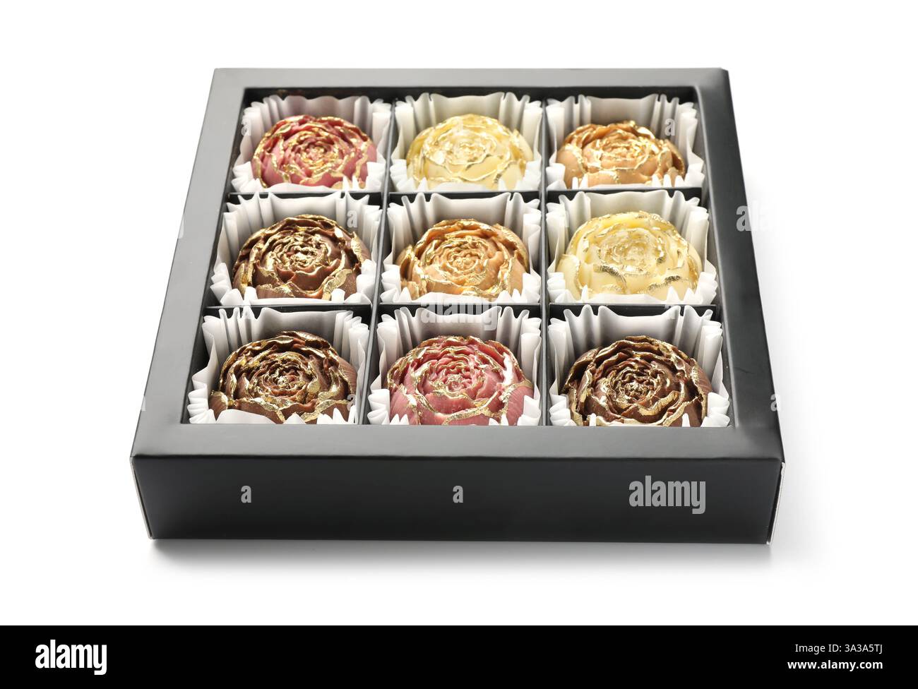 Flower shaped chocolate bonbons in box isolated on white Stock Photo ...