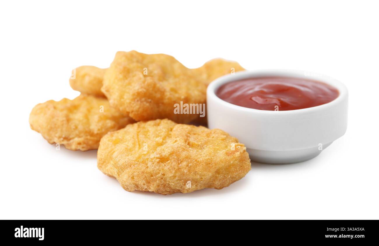 Tasty chicken nuggets with sauce isolated on white Stock Photo - Alamy