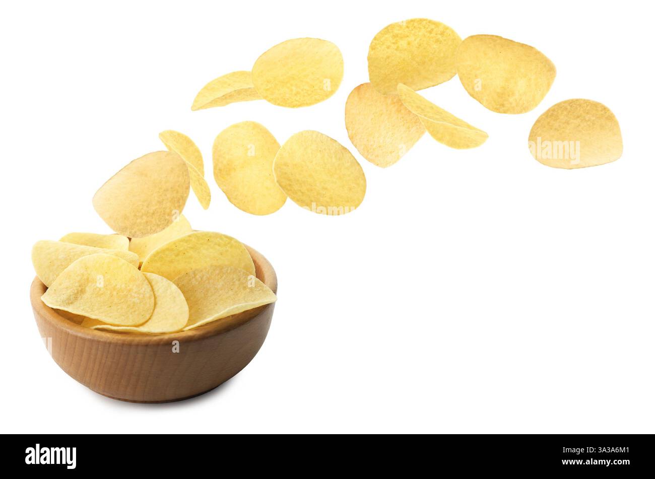 Tasty potato chips falling into bowl on white background Stock Photo ...