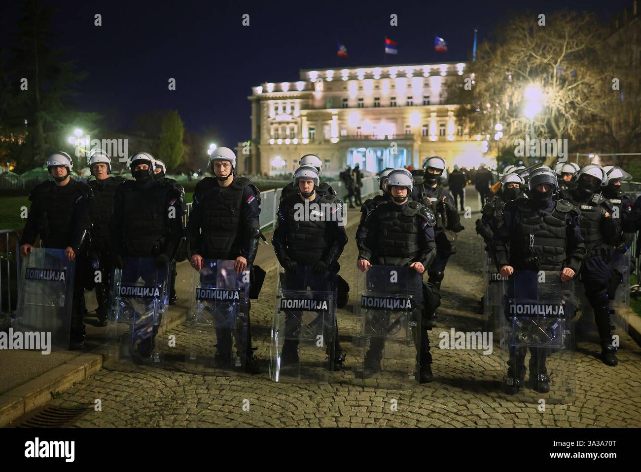 Serbian anti-riot police stand near the Parliament building ahead of a ...