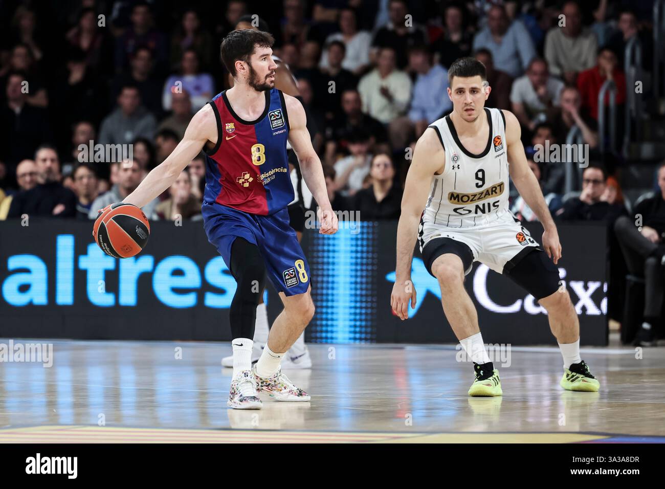 Dario Brizuela of FC Barcelona and Vanja Marinkovic of Partizan Mozzart ...