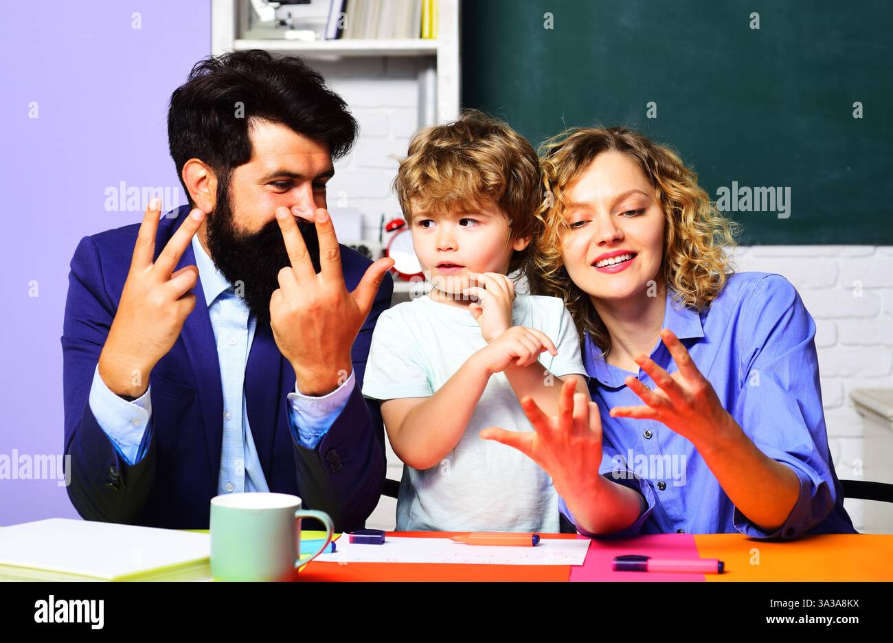 Child boy in classroom study mathematics with teachers and counting on ...