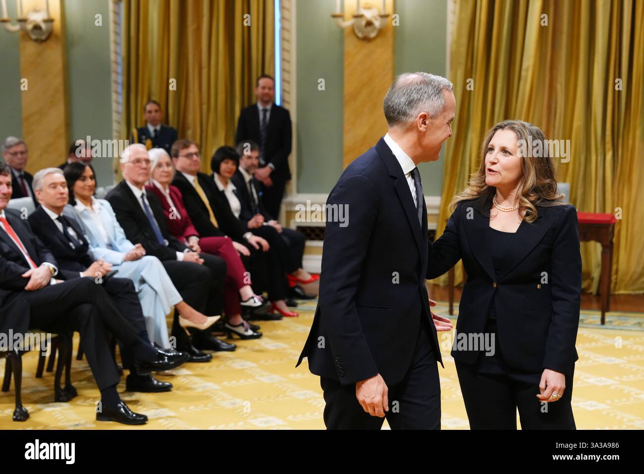 Ottawa, Canada. 14th Mar, 2025. Prime Minister Mark Carney, left ...