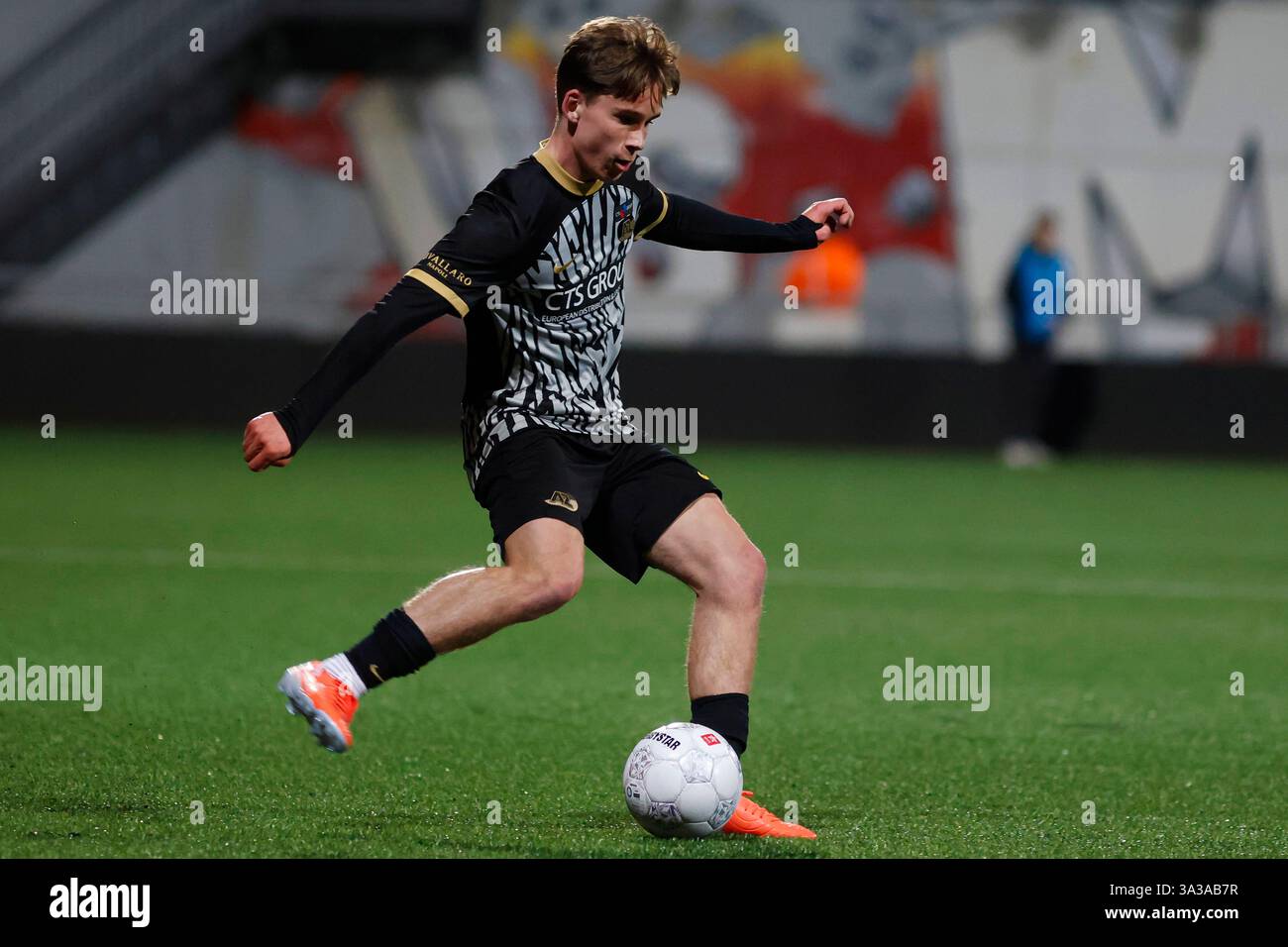 MAASTRICHT, NETHERLANDS - MARCH 14: Mathijs Menu of Jong AZ passes the ...