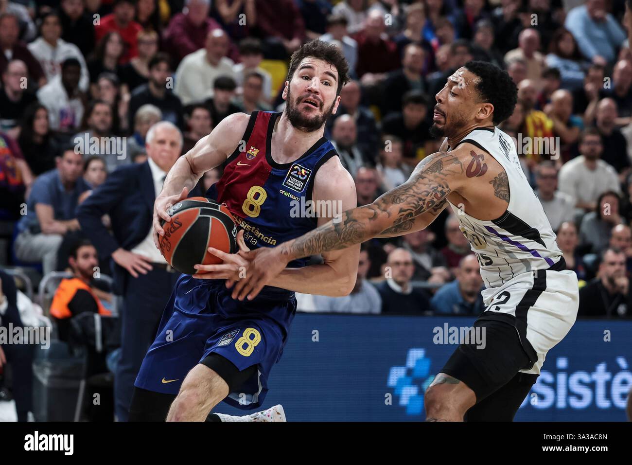 Dario Brizuela of FC Barcelona and Carlik Jones of Partizan Mozzart Bet ...