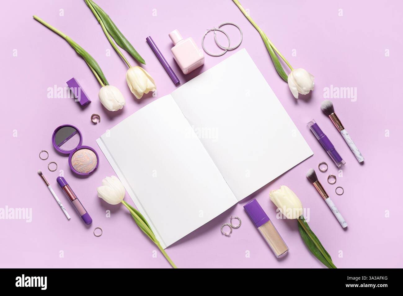Blank fashion magazine with flowers, cosmetics and jewellery on lilac ...