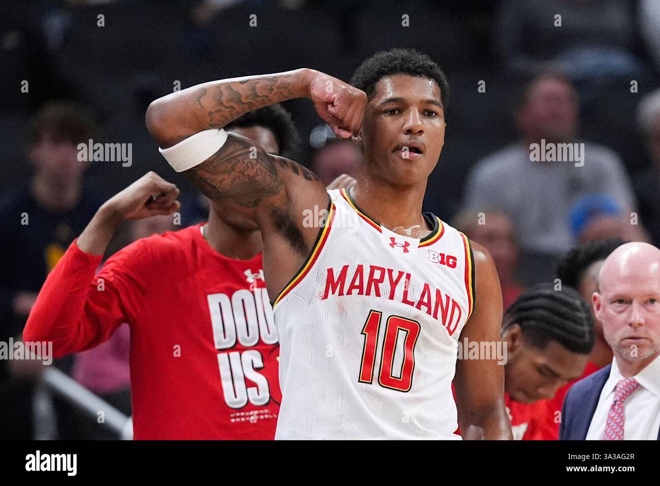 Maryland forward Julian Reese (10) flexes on the bench against Illinois ...
