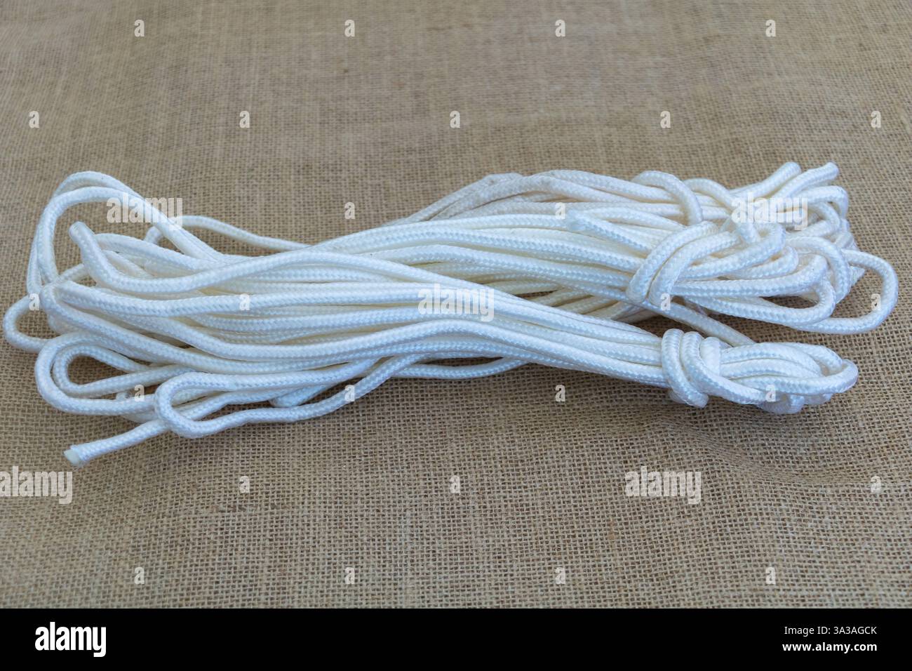 Long white cotton cord, with a soft texture and smooth surface on a ...