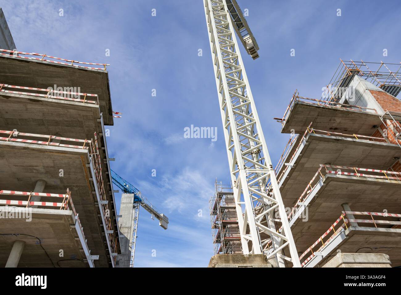 white construction crane between reinforced concrete shells Stock Photo ...