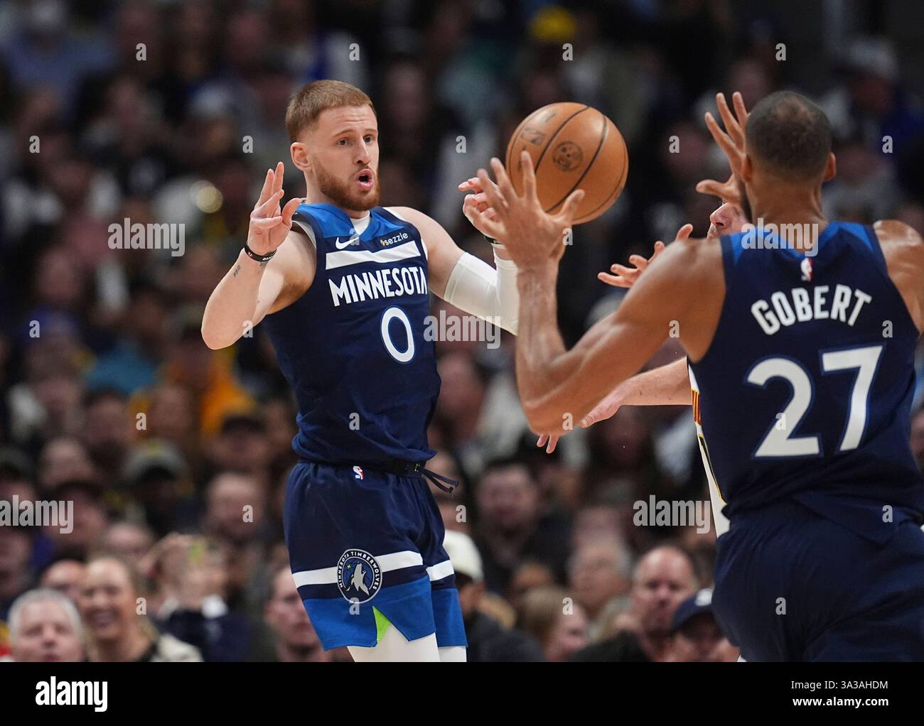 Minnesota Timberwolves guard Donte DiVincenzo (0) passes the ball to ...
