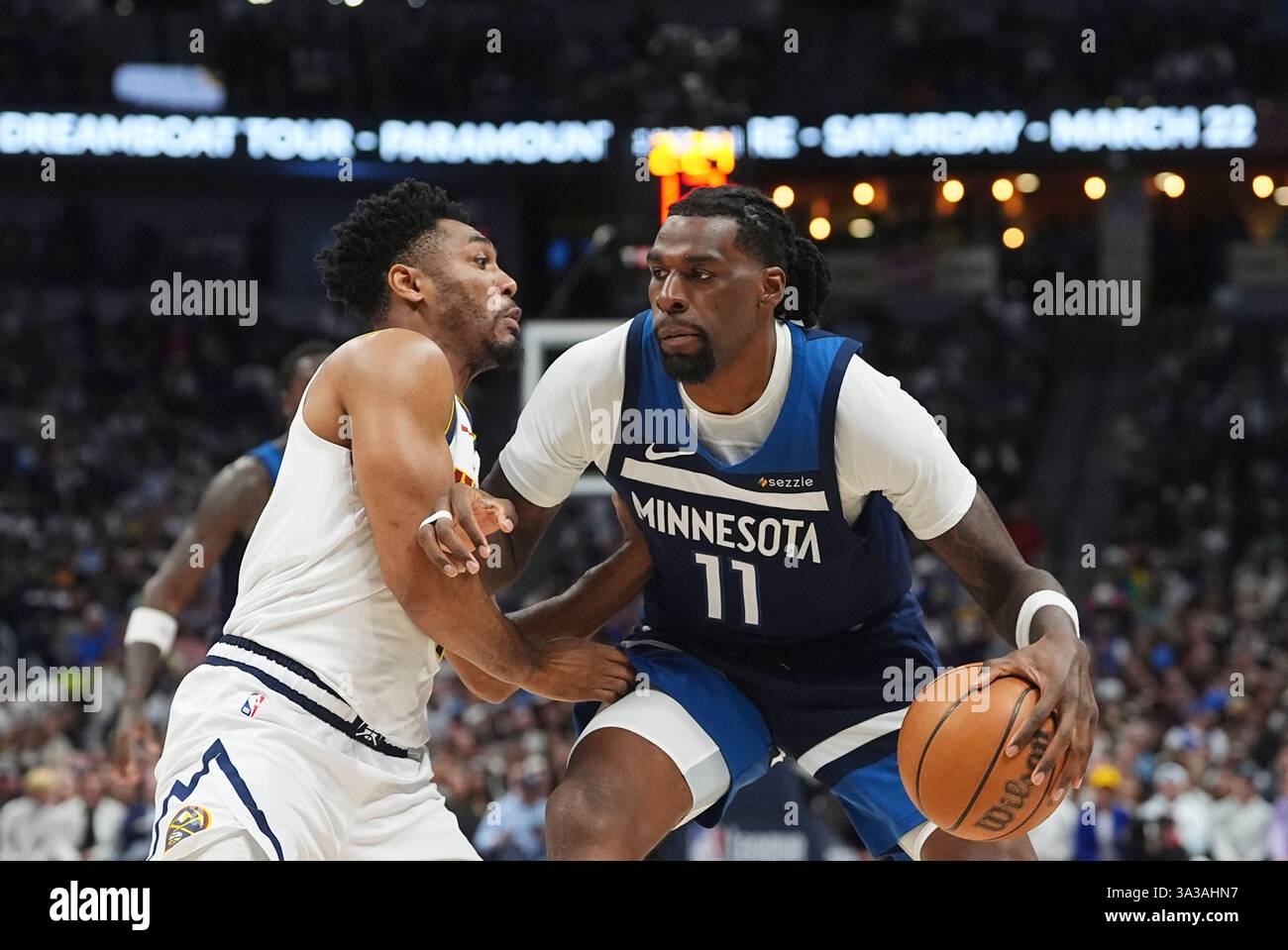 Minnesota Timberwolves center Naz Reid (11) and Denver Nuggets guard ...