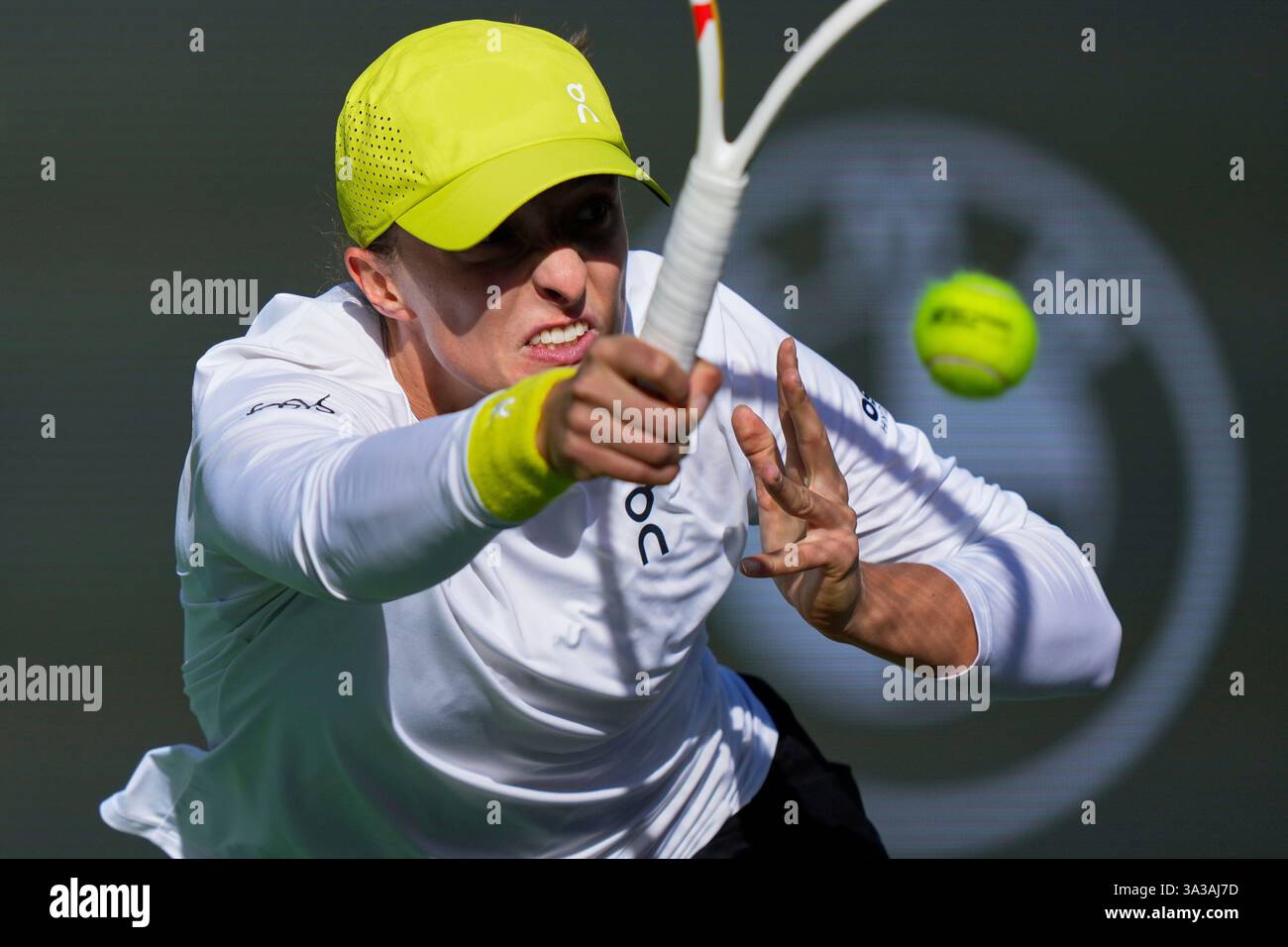 Iga Swiatek, of Poland, returns to Mirra Andreeva, of Russia, during ...