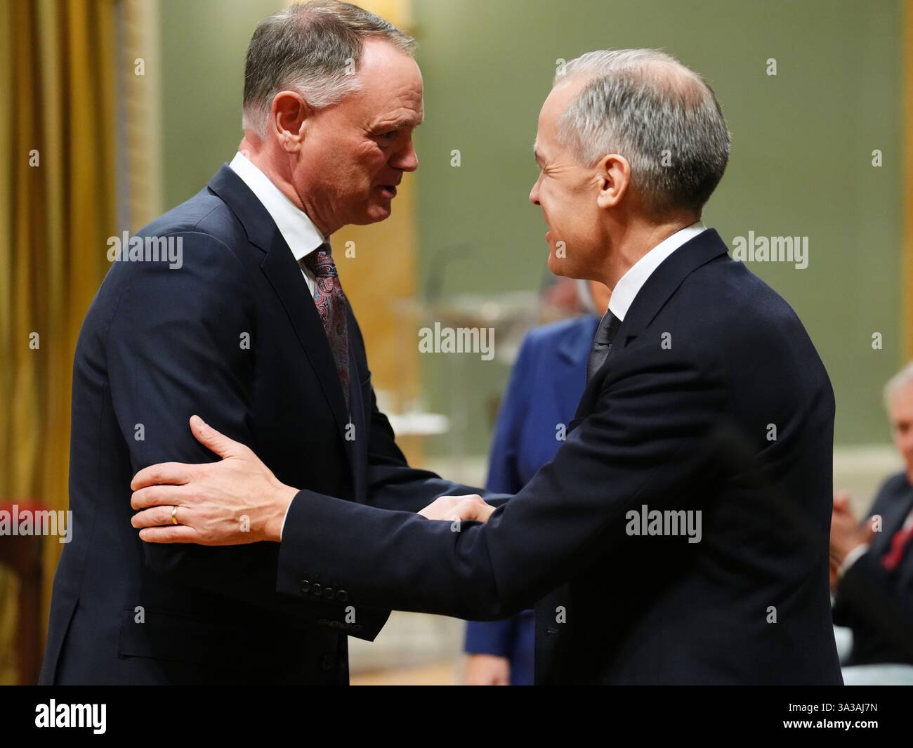 Ottawa, Canada. 14th Mar, 2025. David J. McGuinty is congratulated by ...