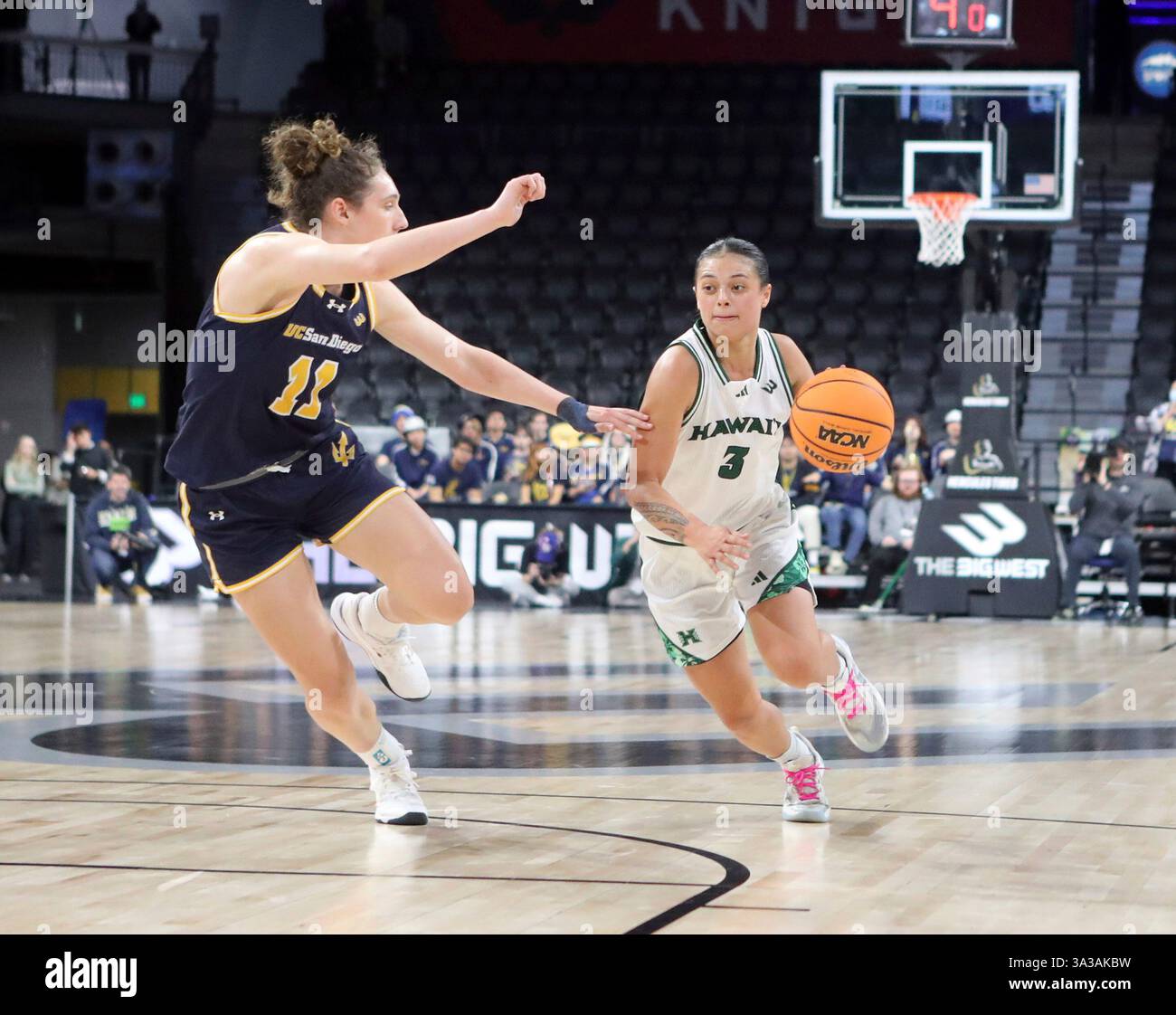 March 14, 2025 - Hawai'i Rainbow Wahine guard Lily Wahinekapu #3 drives ...