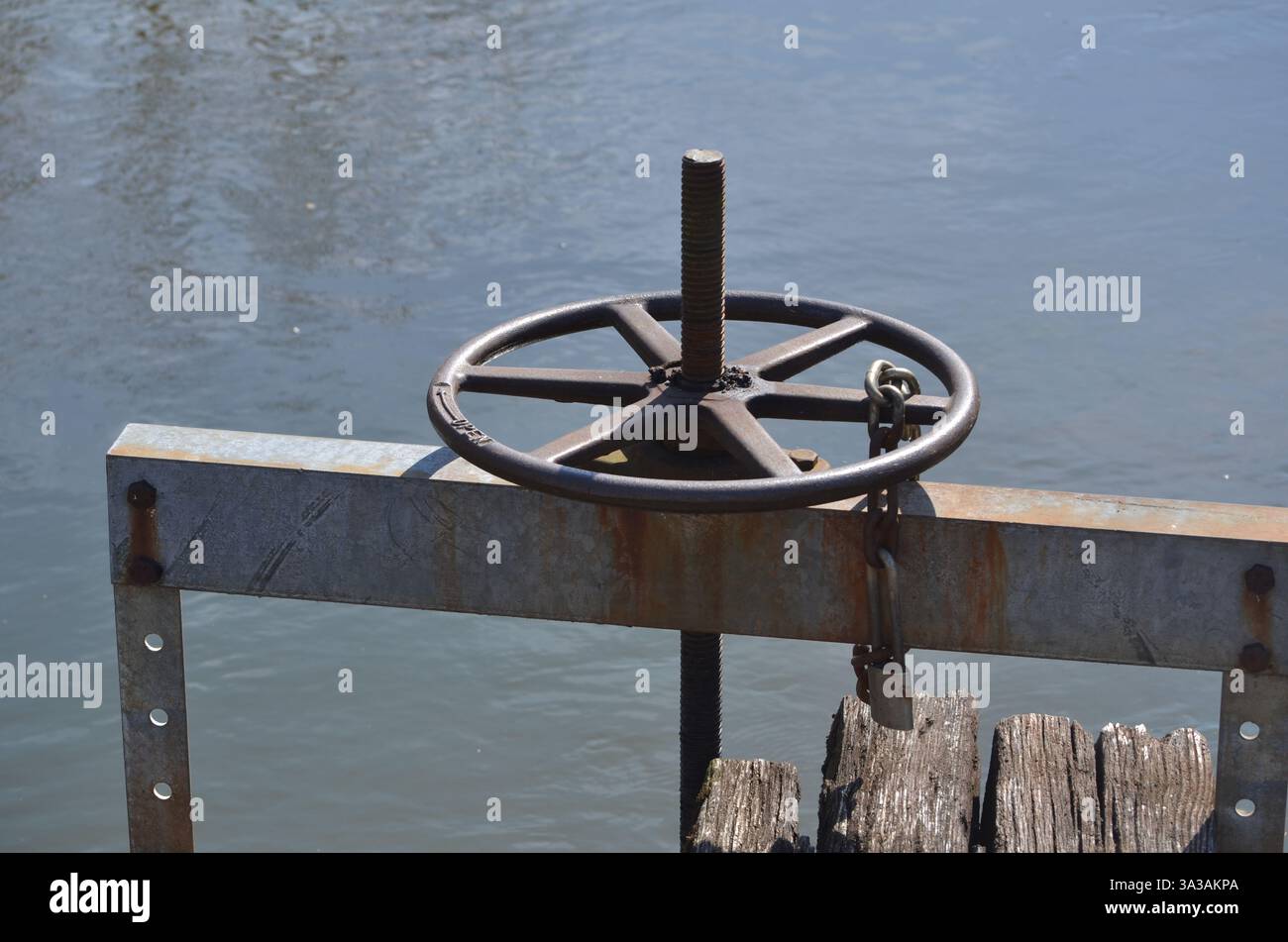 Wheel on a large gate valve Stock Photo - Alamy