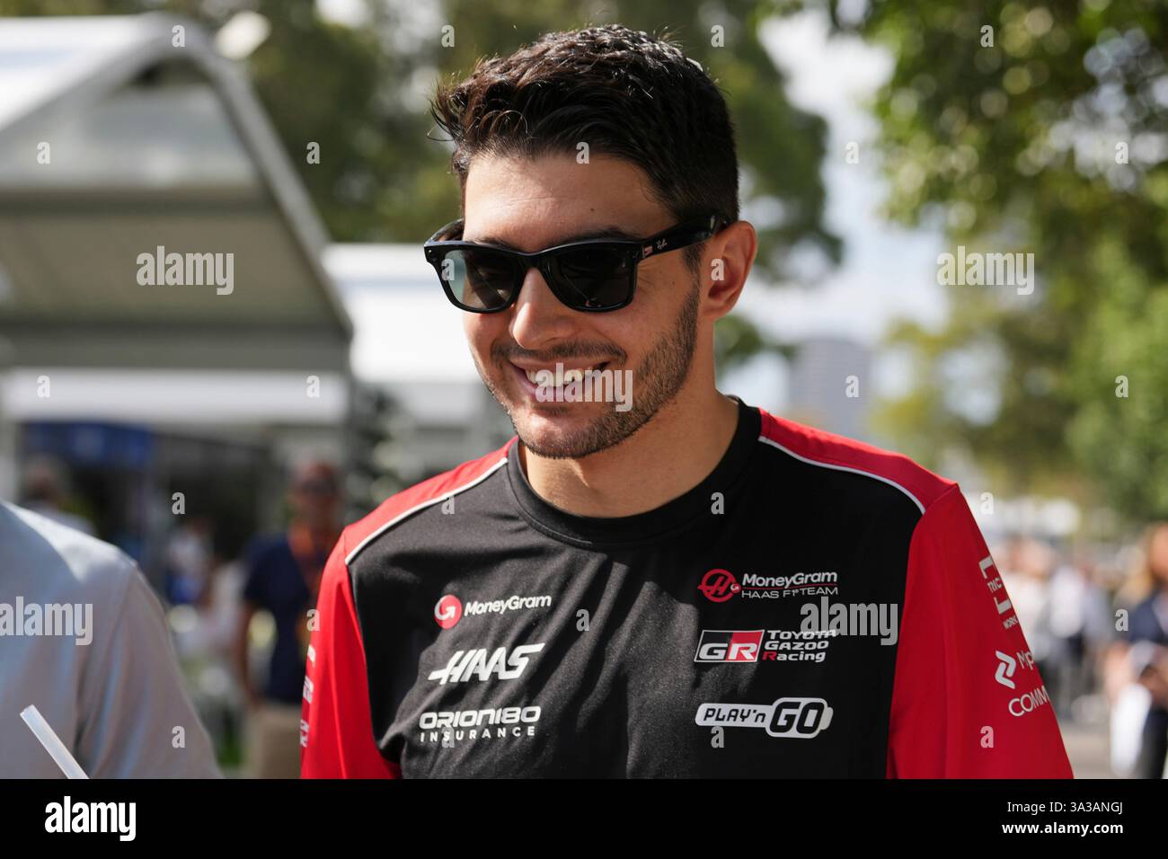 Haas driver Esteban Ocon of France walks through the F1 paddock at the ...