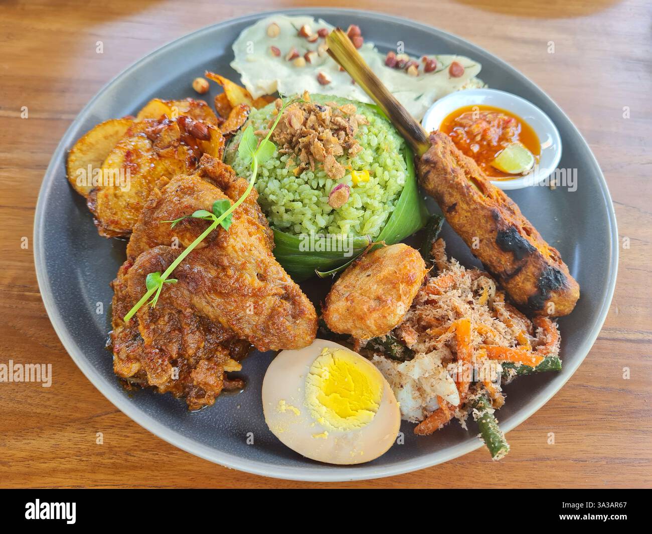 Indonesian Balinese Food - Nasi Campur Bali or Balinese mixed rice with a selection of side ...