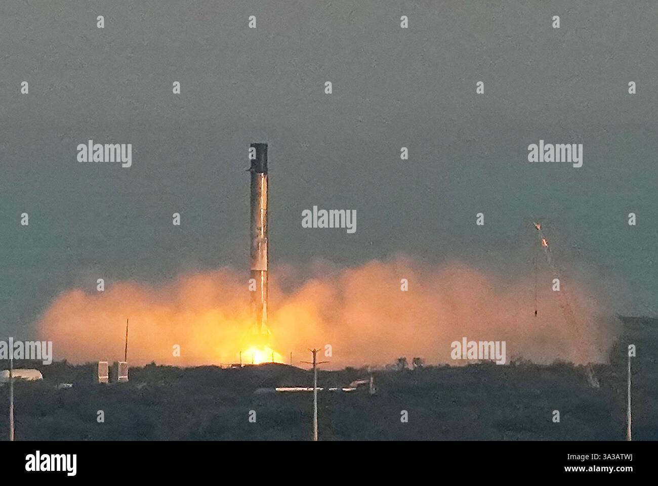 The booster from the SpaceX Falcon 9 rocket returns to land after NASA ...