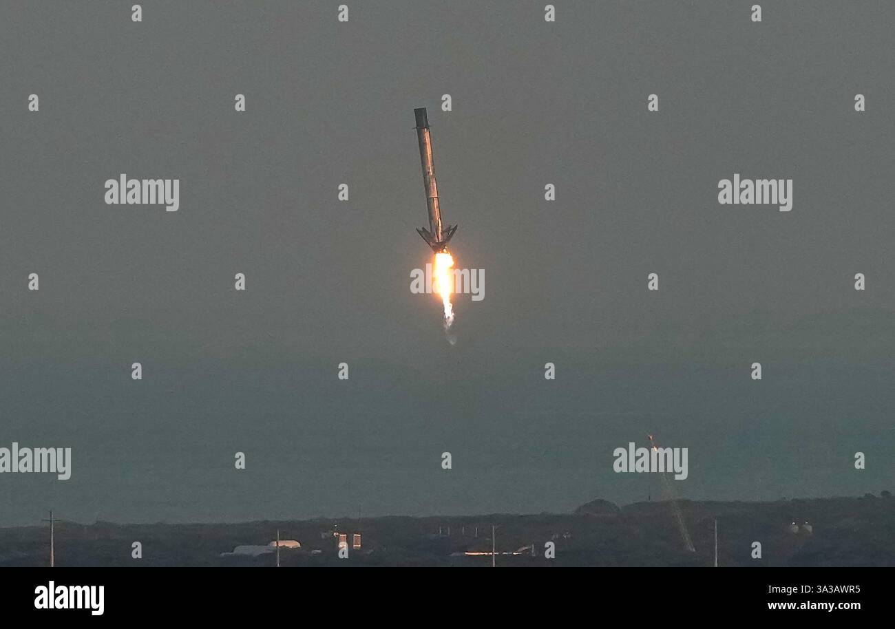 The booster from the SpaceX Falcon 9 rocket returns to land after NASA ...