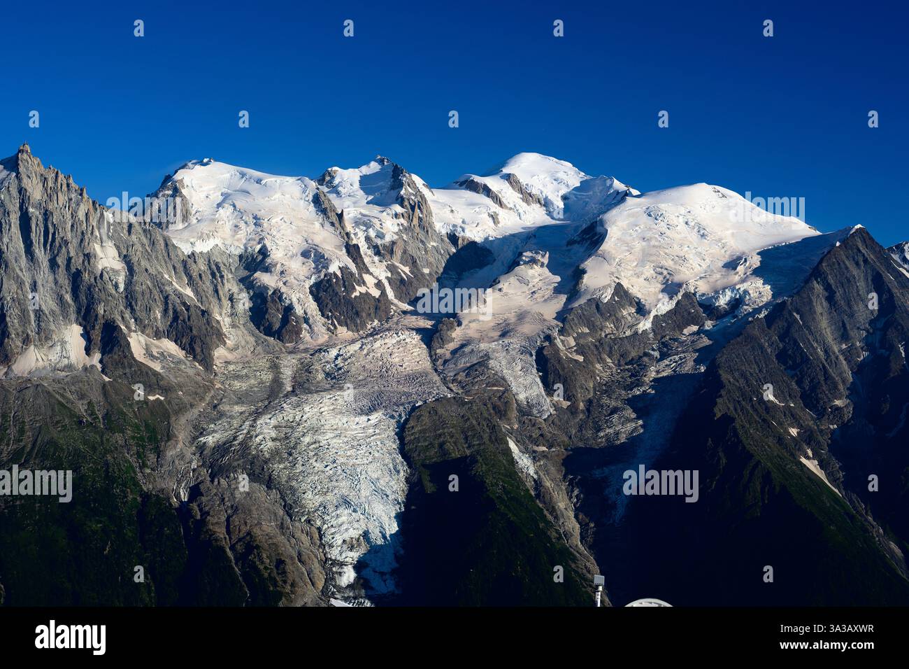 The Mont Blanc massif with the snow-capped Mont Blanc peak, view from ...