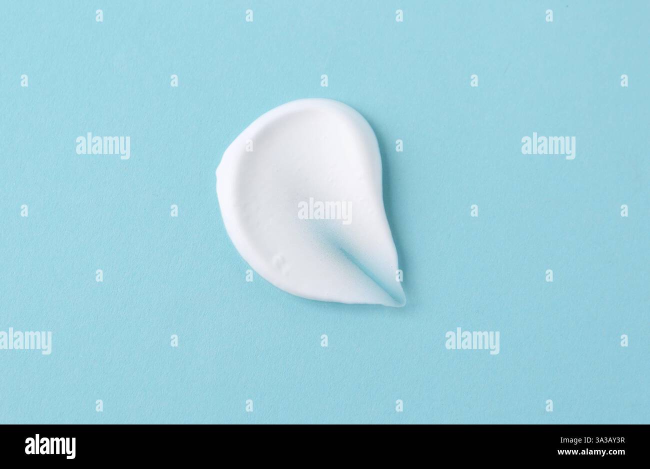 Sample of fluffy foam on light blue background, top view Stock Photo ...