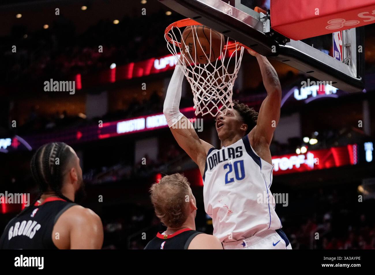Dallas Mavericks forward Kessler Edwards (20) dunks during the first ...