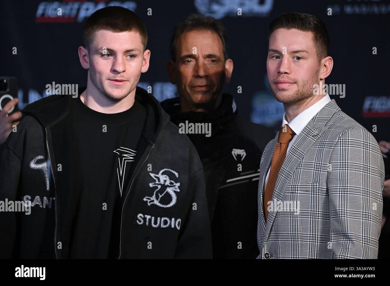 (L-R) Boxing promoter Tom Loeffler stands professional boxers Callum ...