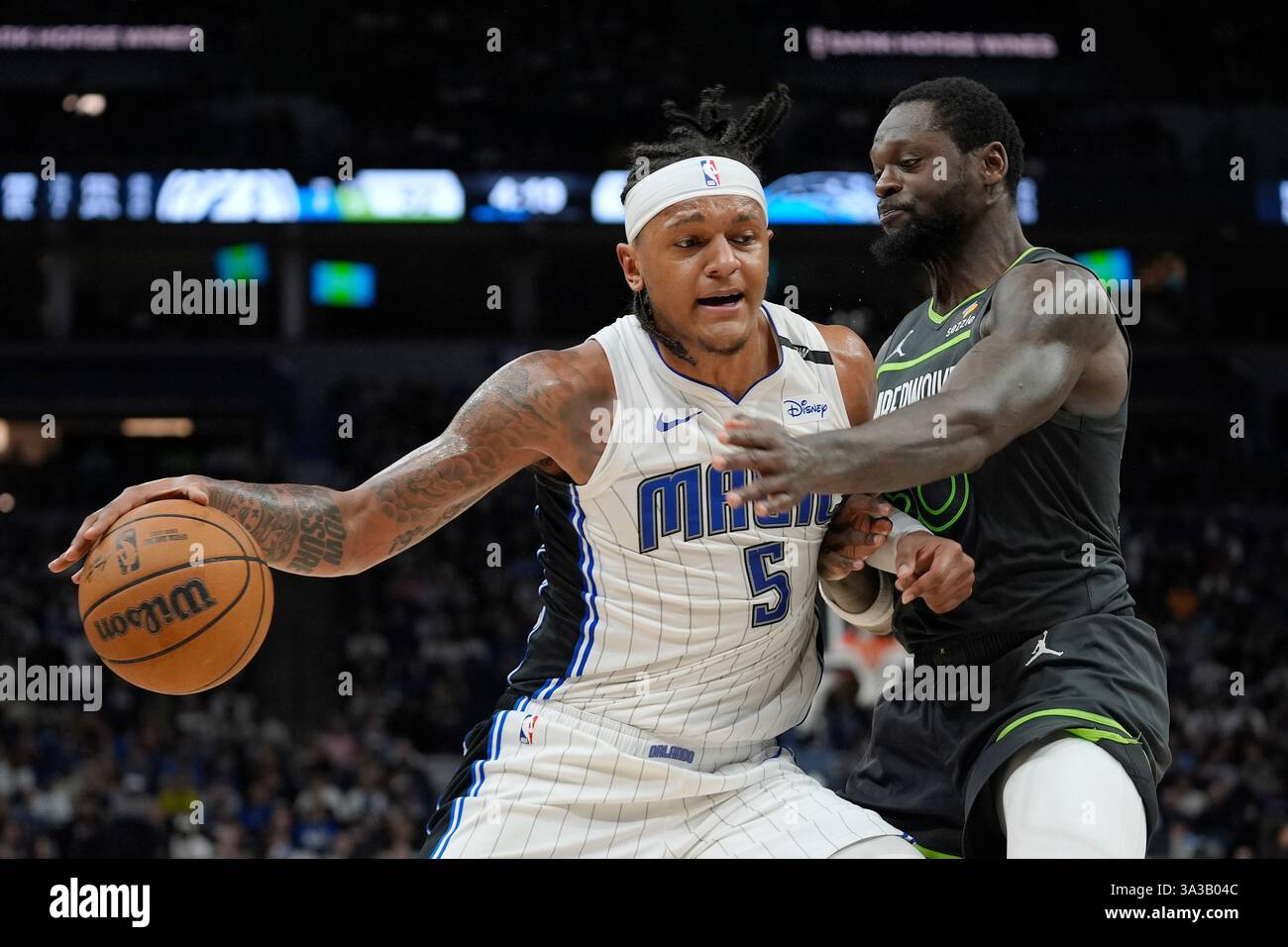 Orlando Magic forward Paolo Banchero (5) works toward the basket as ...