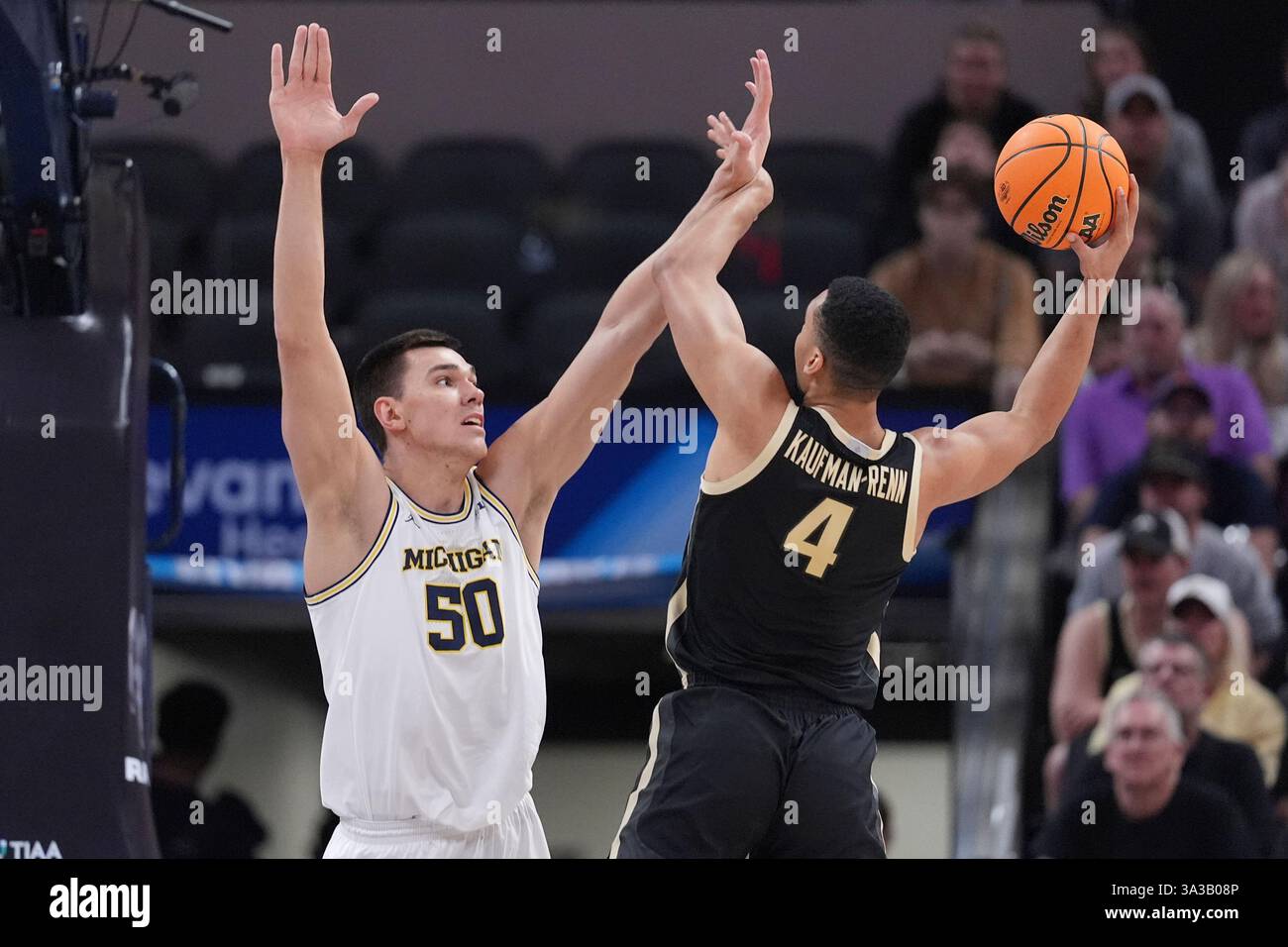 Purdue forward Trey Kaufman-Renn (4) shoots on Michigan center ...