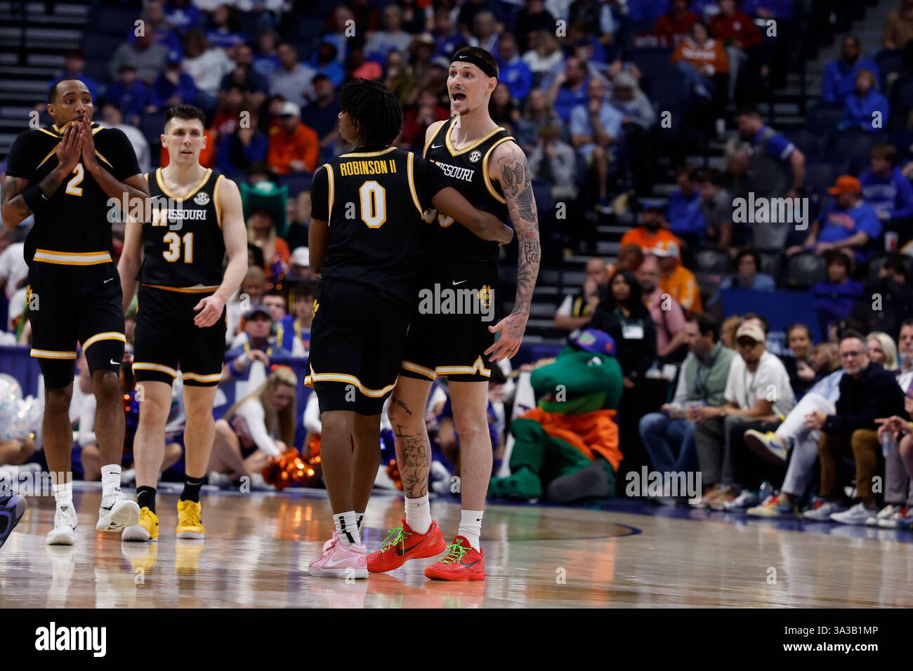 NASHVILLE, TN - MARCH 14: Missouri Tigers guard Anthony Robinson II (0 ...