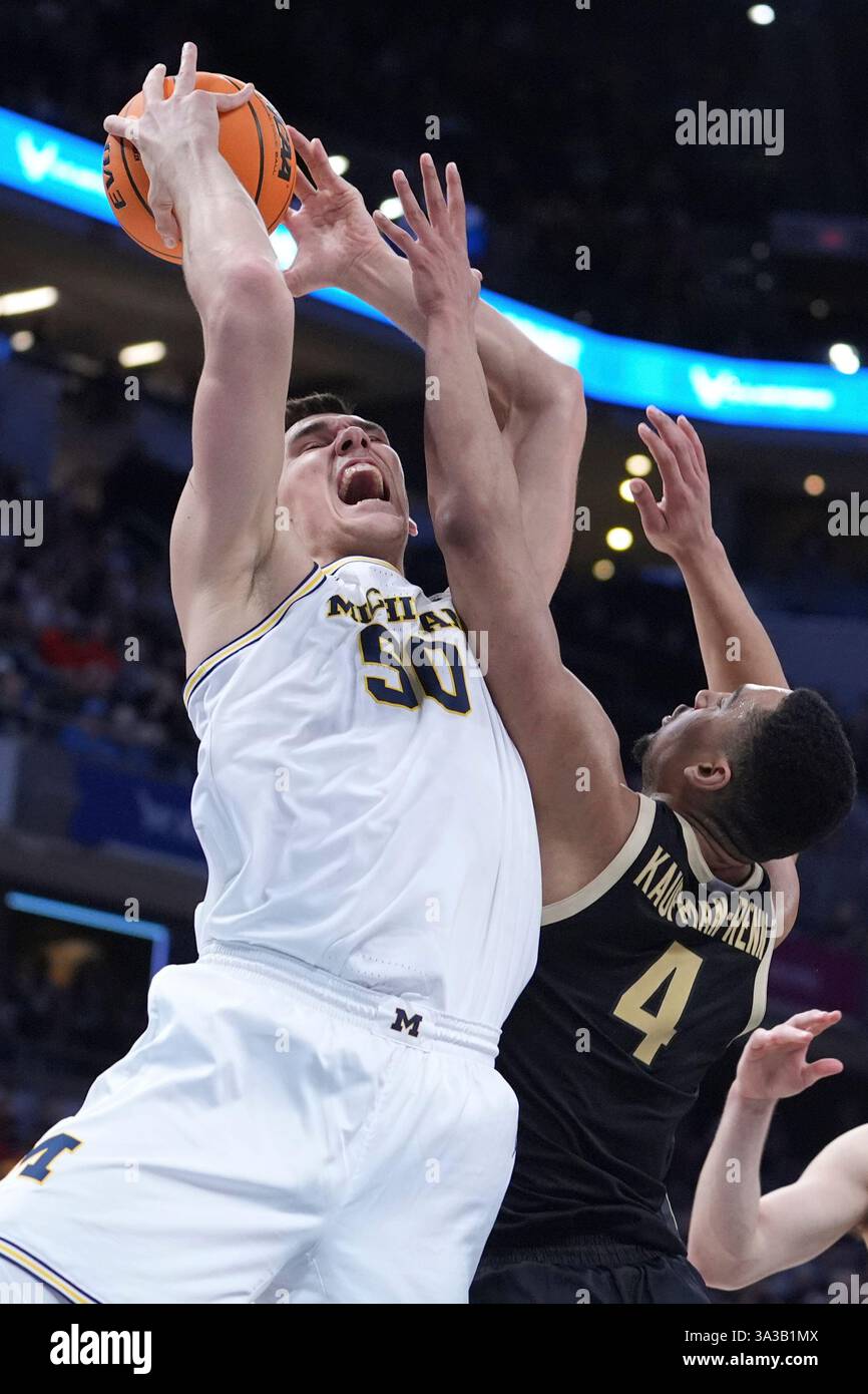 Michigan center Vladislav Goldin (50) shoots on Purdue forward Trey ...