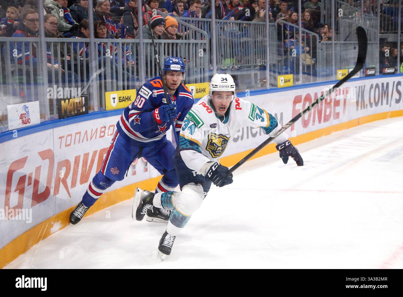 Sergei Popov (34) of Sochi and Valentin Zykov (90) of SKA Hockey Club ...