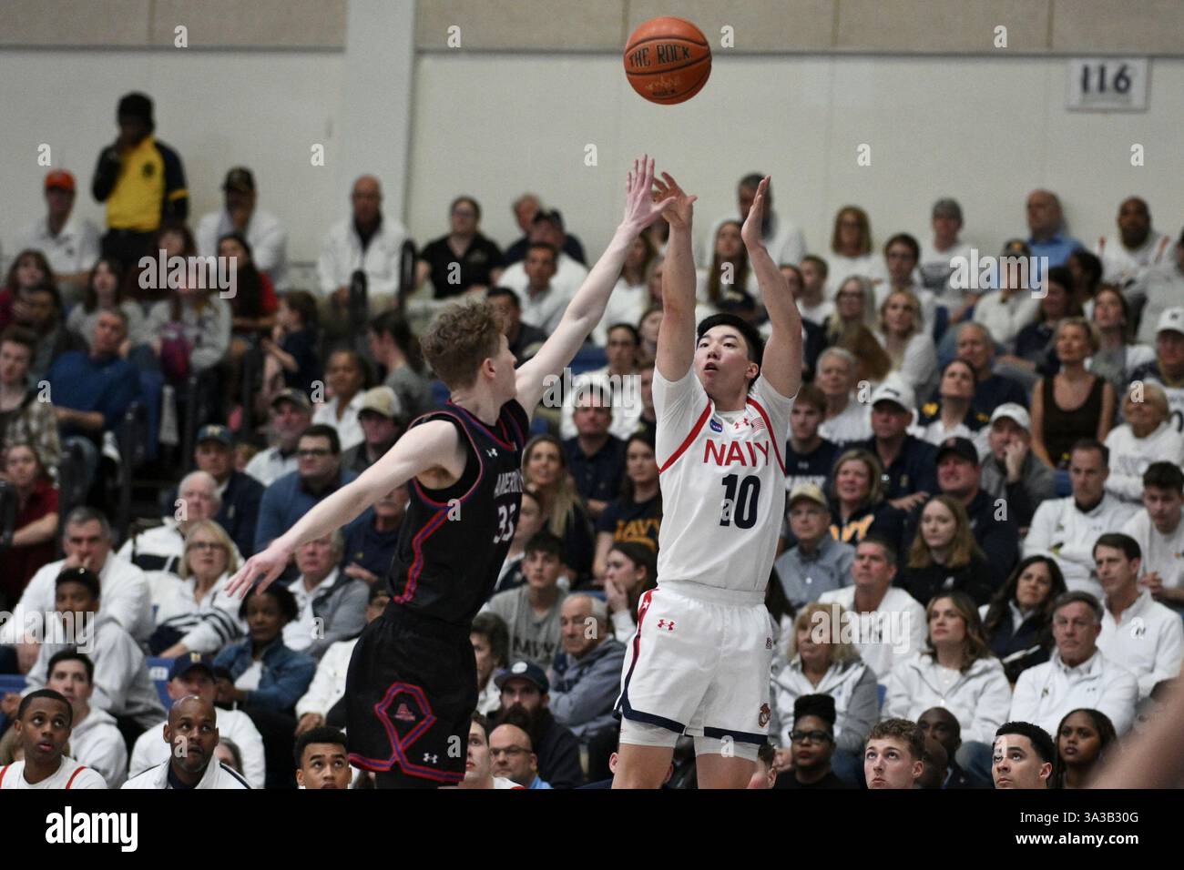 Navy guard Jinwoo Kim (10) attempts a three point basket as American ...