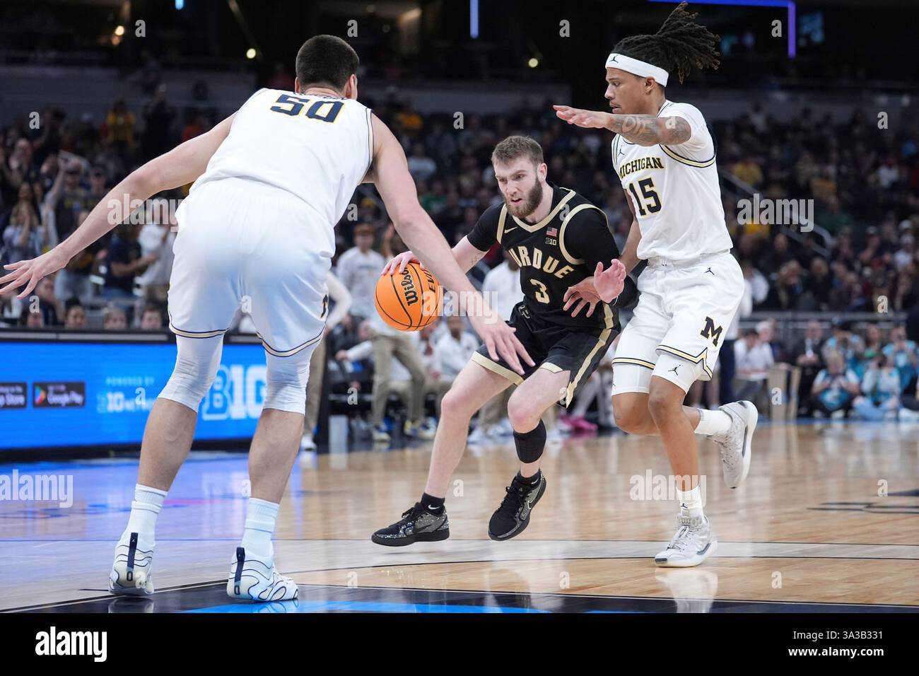 Purdue guard Braden Smith (3) drives on Michigan guard Rubin Jones (15 ...
