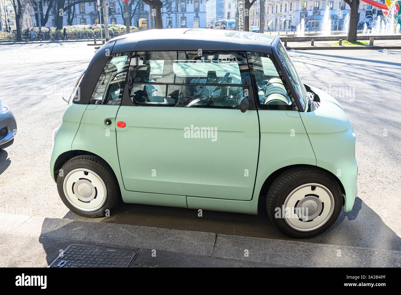 Fiat Topolino electric quadricycle micro car parked on side of a road ...