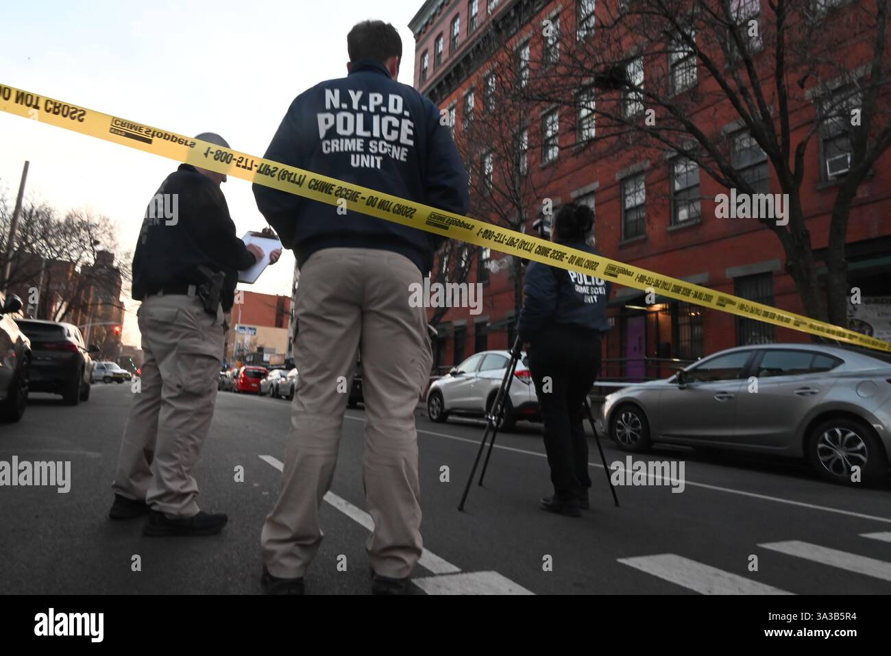 Members of the New York City Police Department Crime Scene Unit mark ...