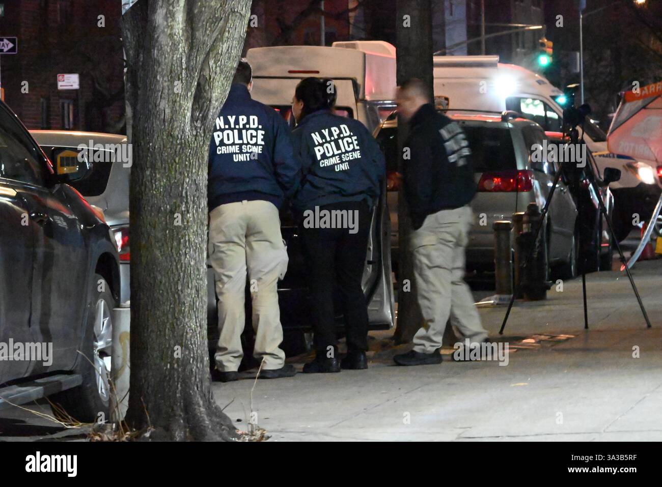 Members of the New York City Police Department Crime Scene Unit mark ...