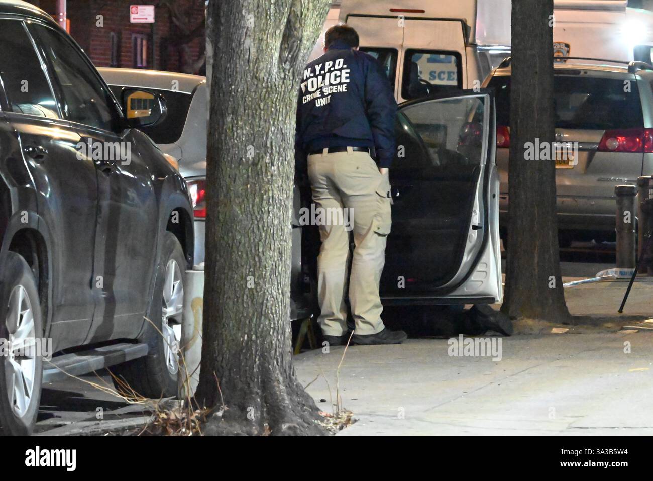 Members of the New York City Police Department Crime Scene Unit mark ...