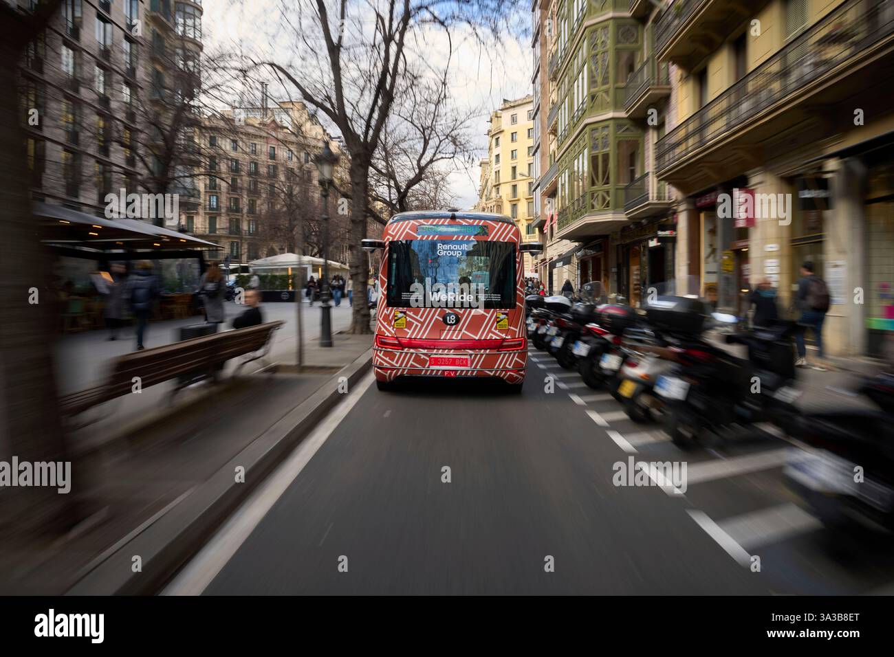 A driverless mini-bus, presented by WeRide and Renault Group, drives ...