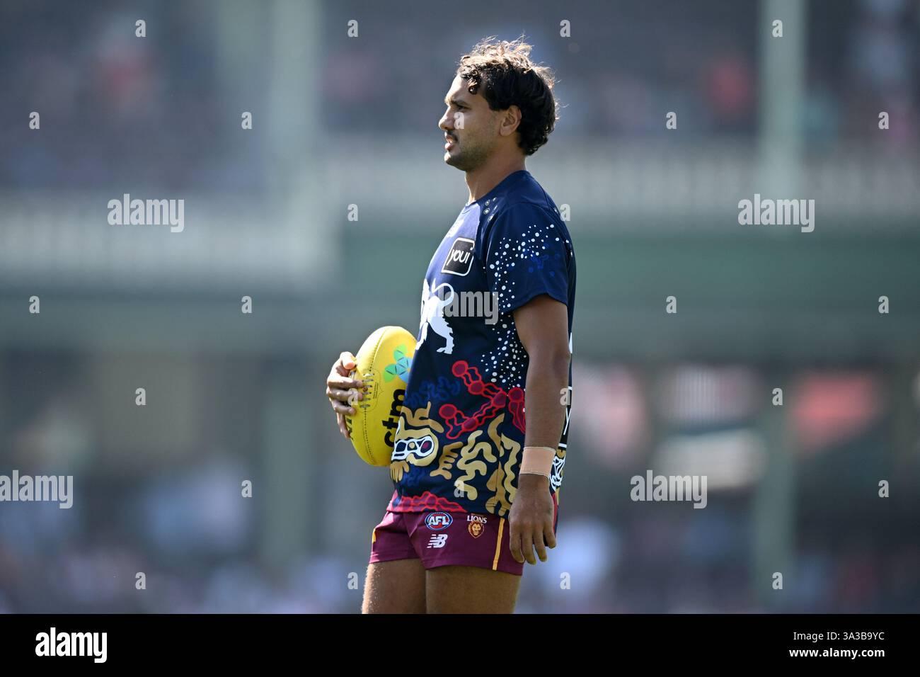 Callum Ah Chee of the Lions during the warm up ahead of the AFL Round 1 ...