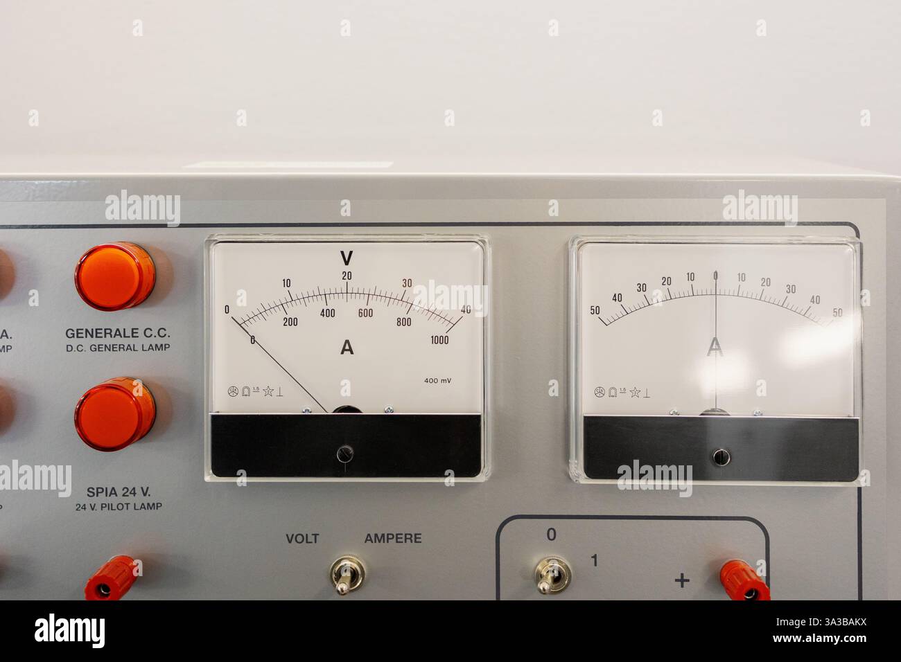 Electrical meters show voltage and amperage readings in a well-lit ...