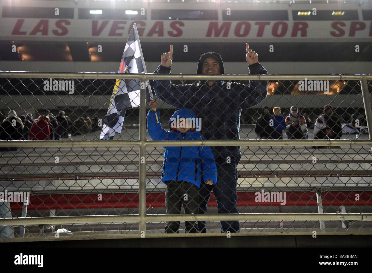 LAS VEGAS, NV - MARCH 14: A young fan waves the Sunoco Checkered Flag ...