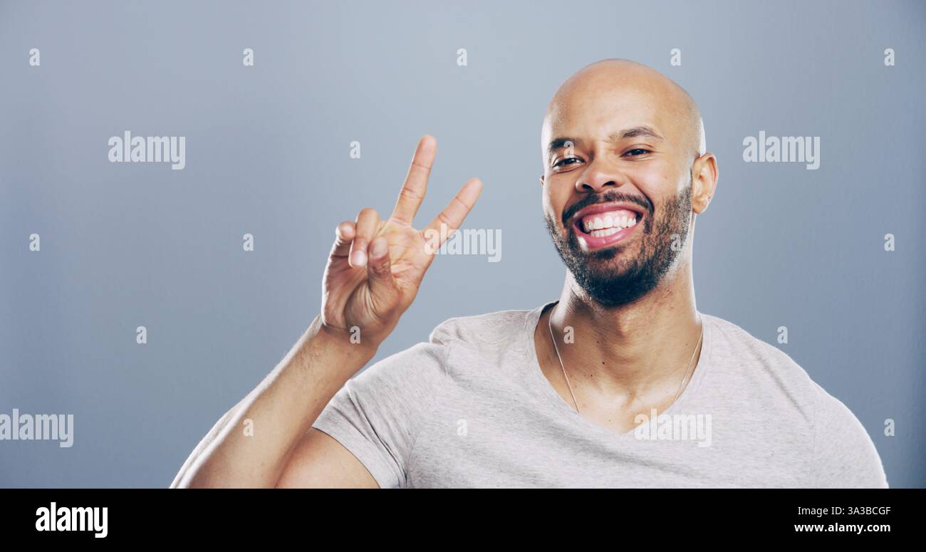 Studio, black man and portrait with sign for peace, support and ...