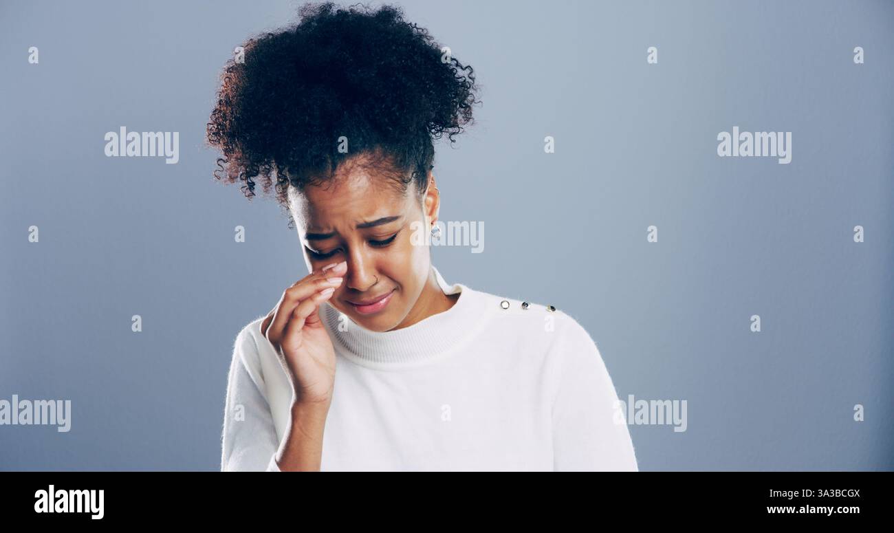 Crying, girl and sad with depression in studio for broken heart, trauma ...