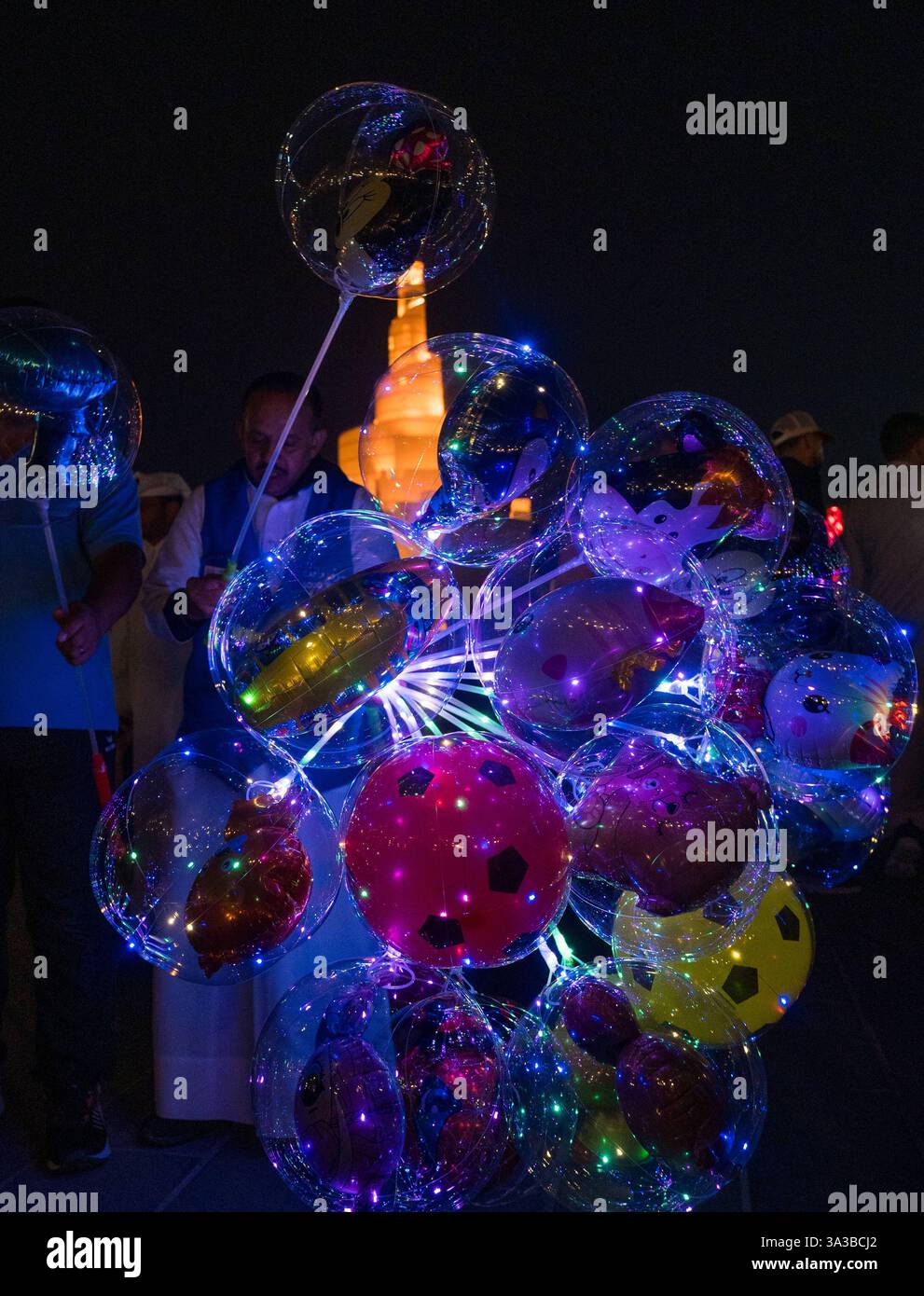 Doha Ramadan Garangao Festival 2025 A man sells balloons during ...