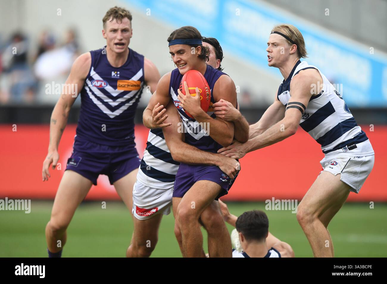 Geelong, Australia. 15th Mar, 2025. Murphy Reid of the Dockers (second ...