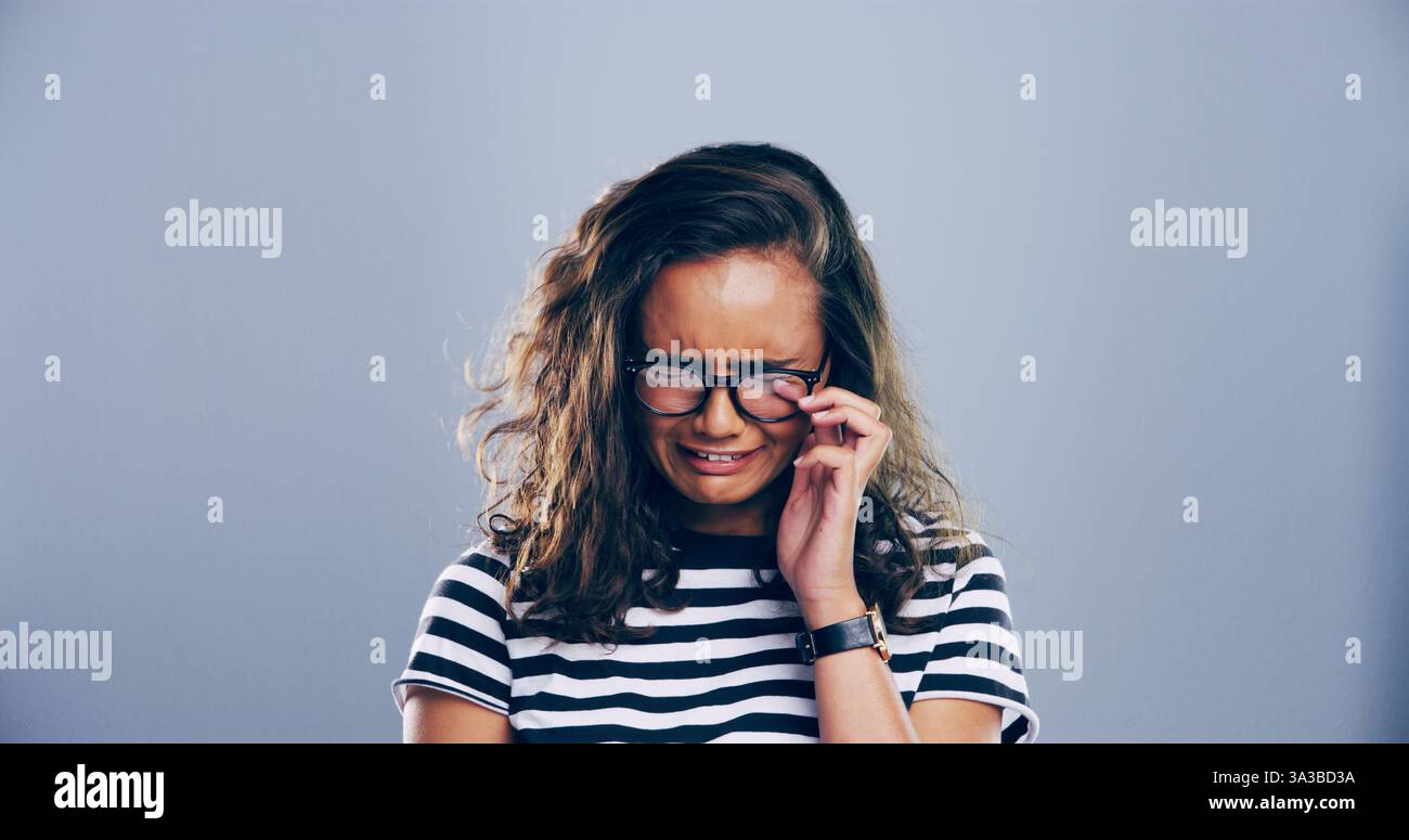 Sad, girl and crying with emotions in studio for mourning loss, broken ...