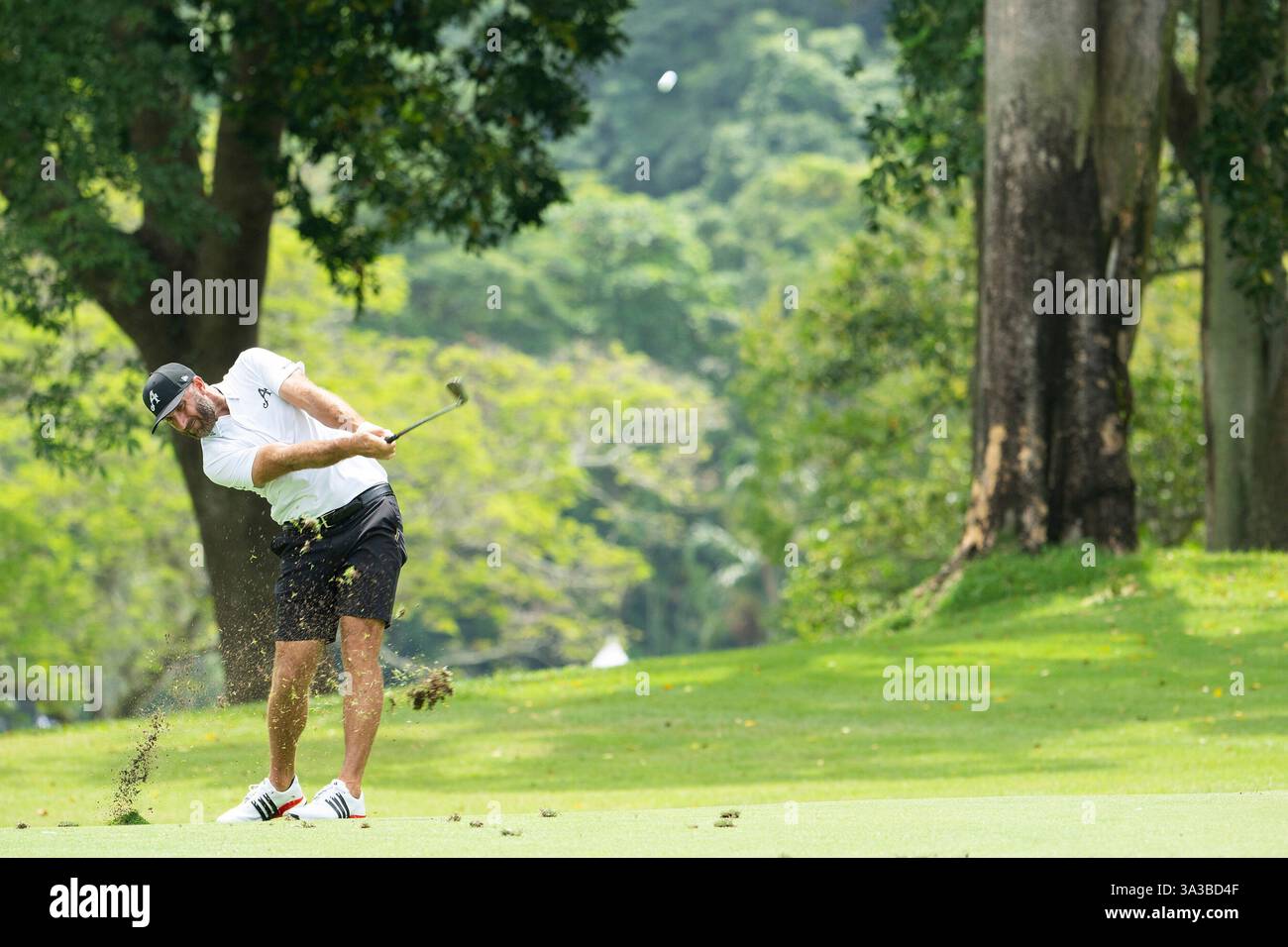 Captain Dustin Johnson of 4Aces GC hits his shot from the fairway on ...