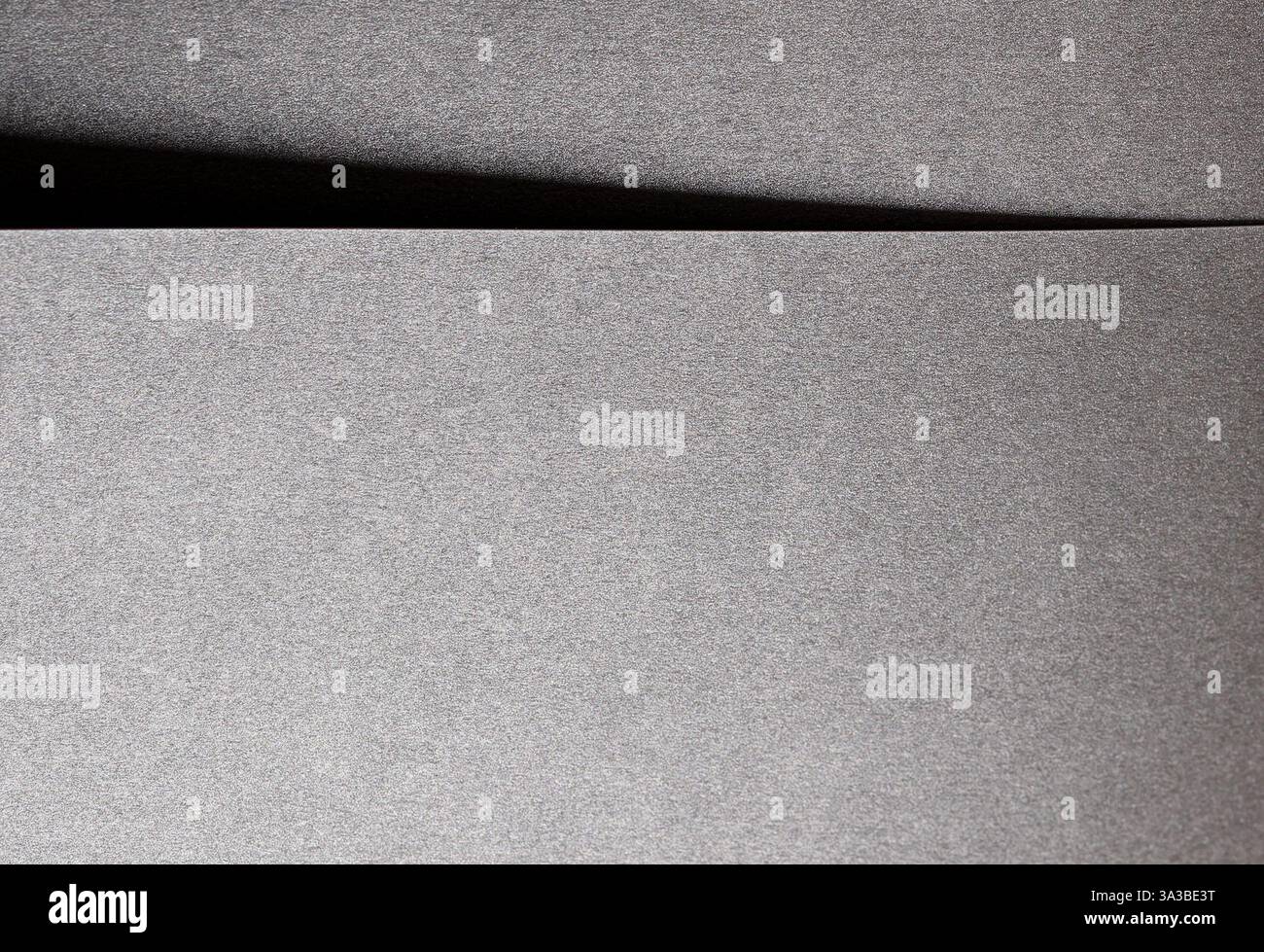 Gray metallic paper background with a glossy, satin finish and ...