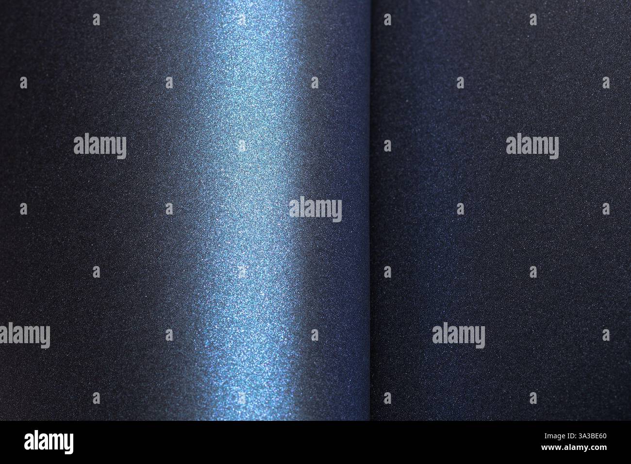 Navy blue paper background with a glossy, pearlescent texture and a ...